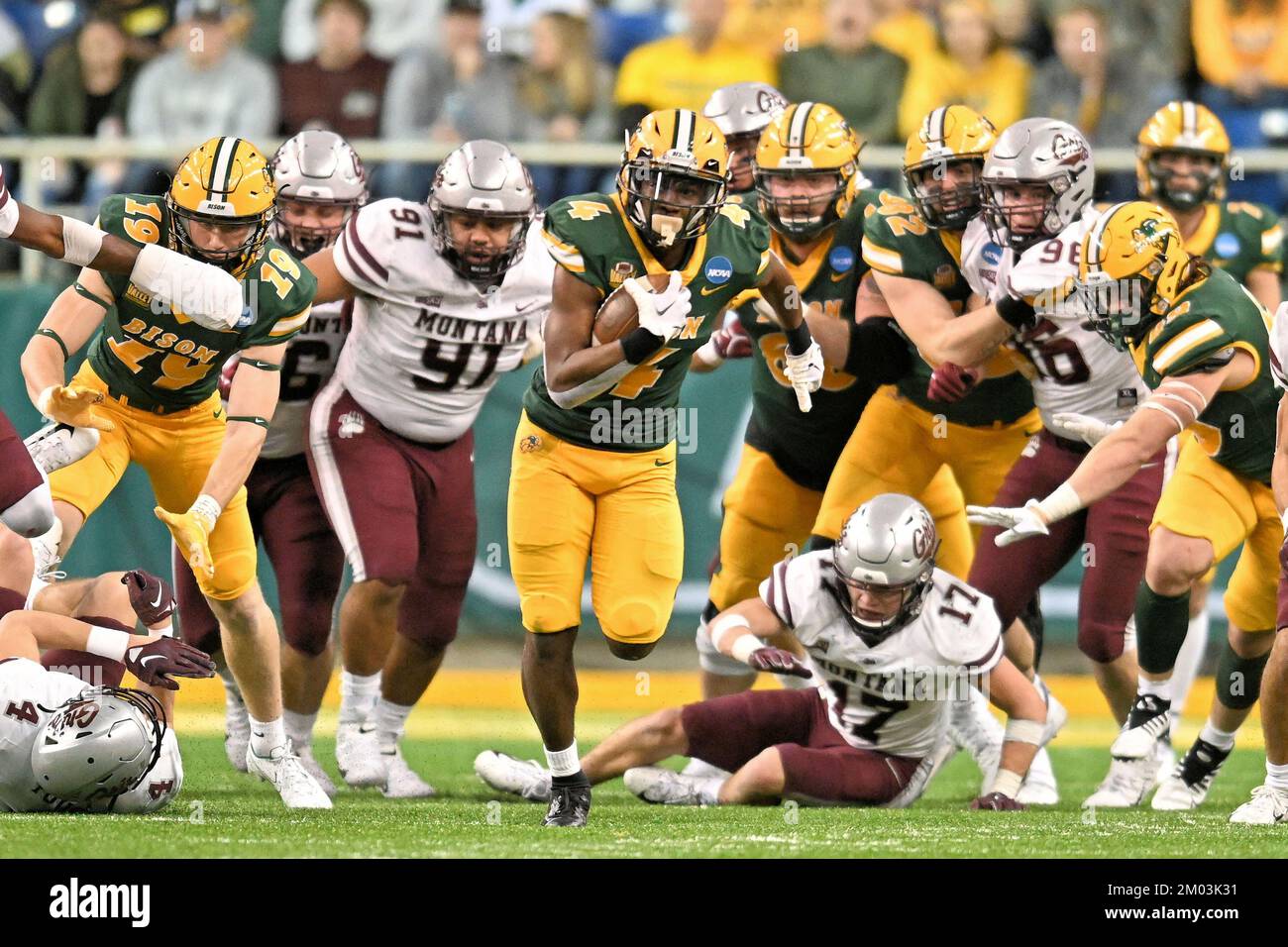 North Dakota State Bison running back Kobe Johnson (4) breaks free of ...