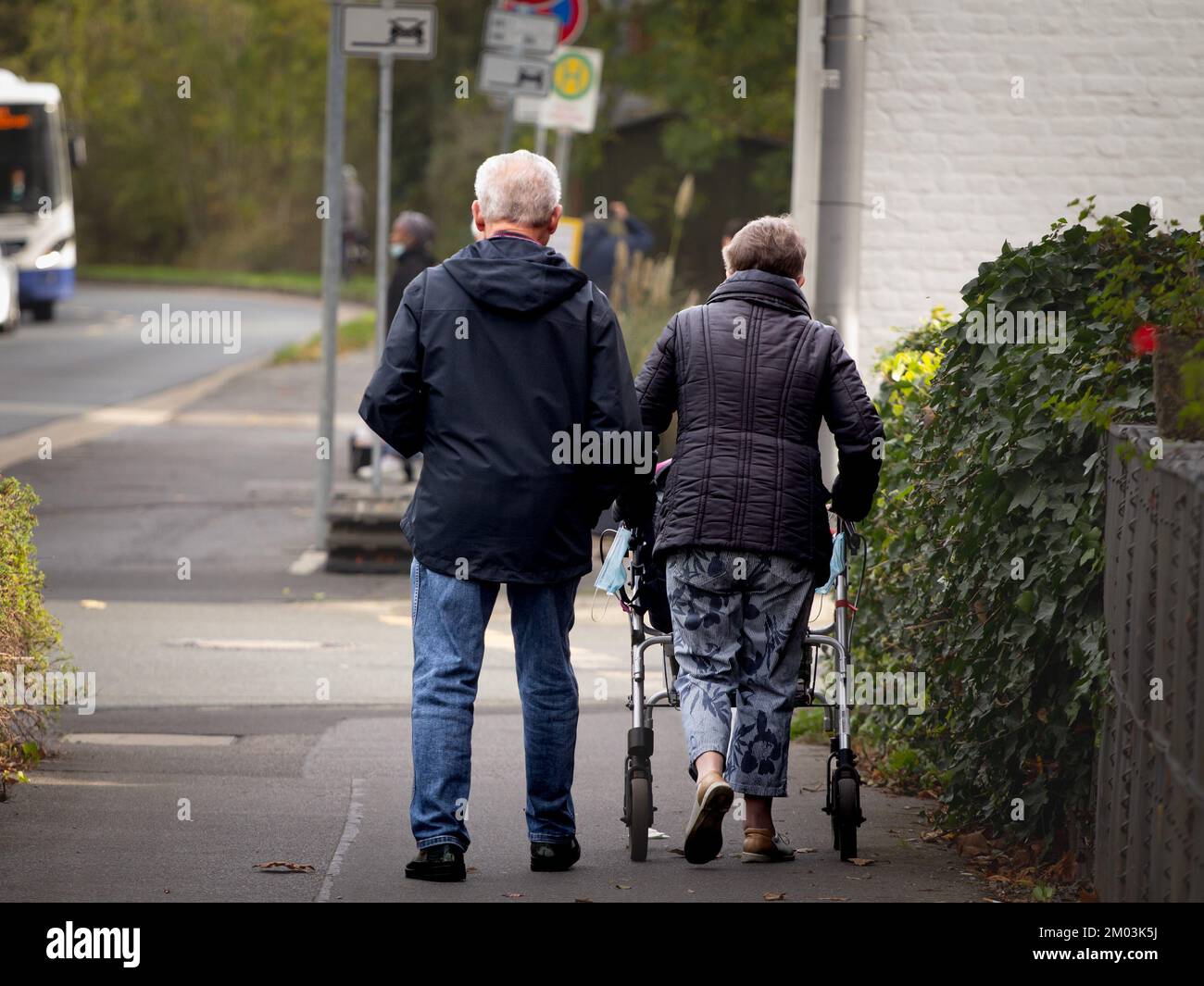 Picture of a senior couple in Germany walking in the streets of Aachen ...