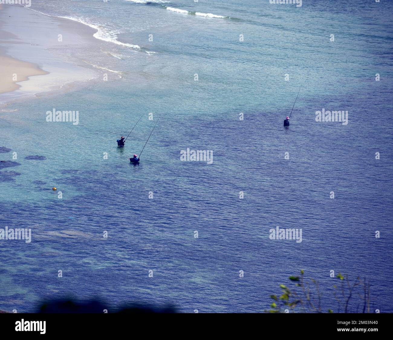 Local indigenous Bajau men fishing at the Tip of Borneo, Sabah ...