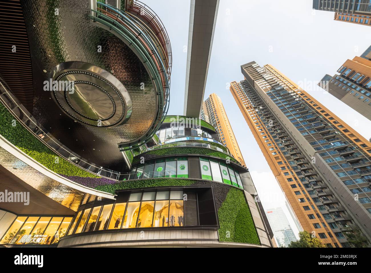 Commercial mall entrance and skyscrapers against sky Stock Photo - Alamy