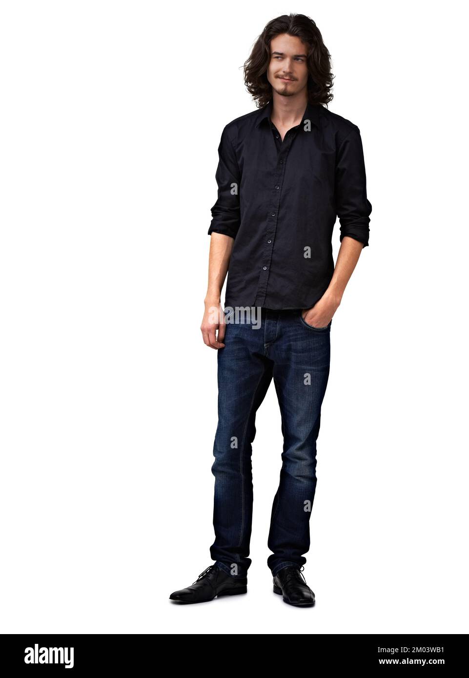 Feeling cocky. Young handsome male model giving a cocky smirk ...