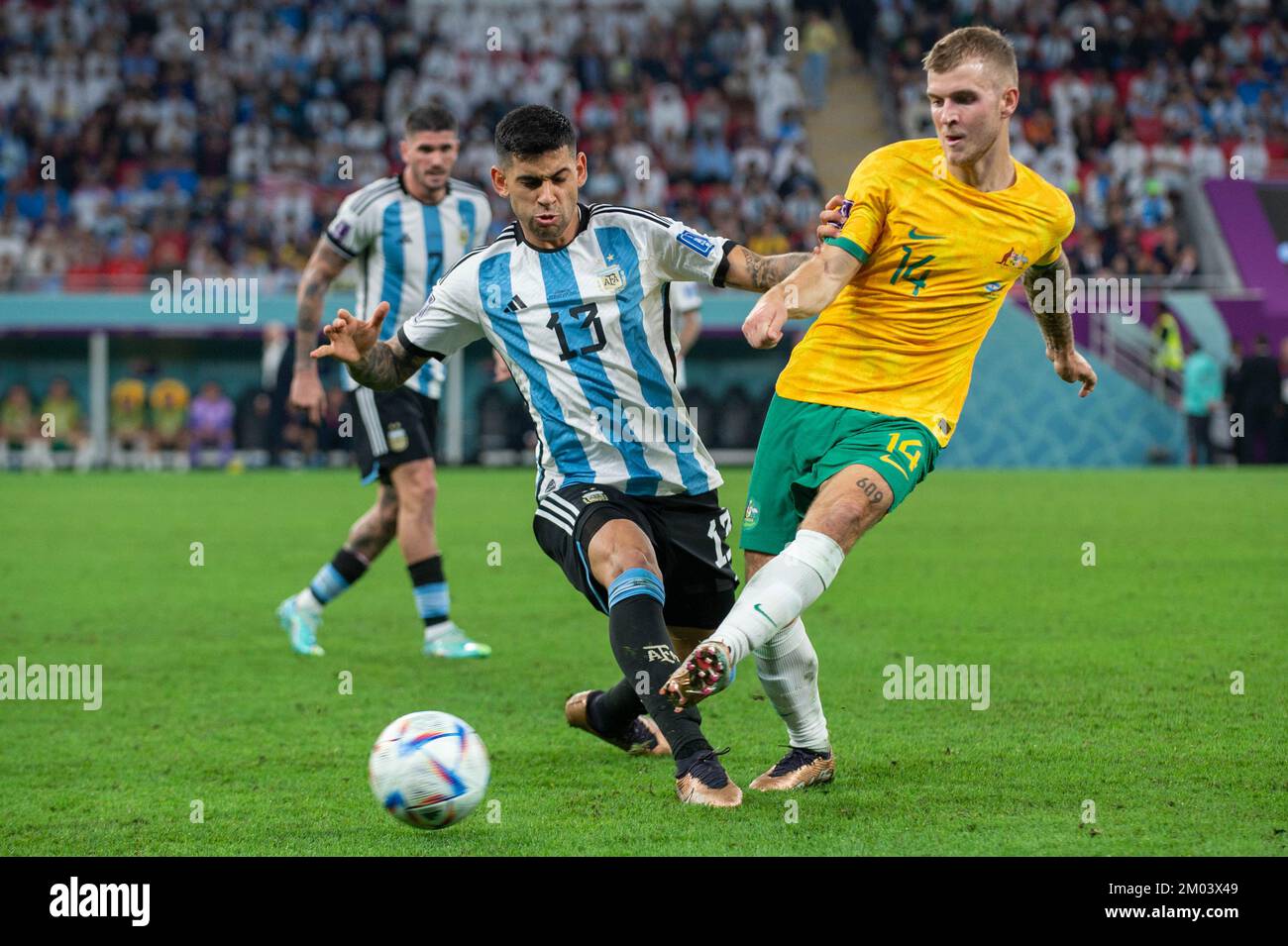 Cristian Romero of Argentina and Riley McGree of Australiaduring the ...
