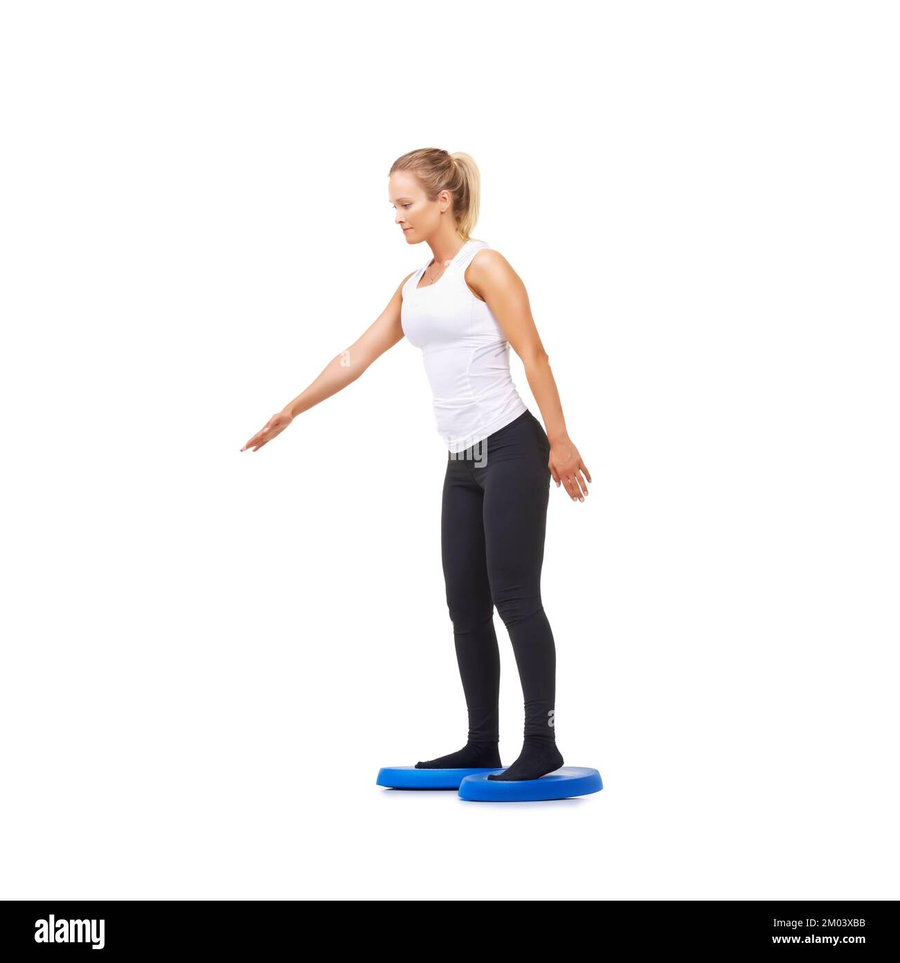 Trying to perfect her posture. Studio shot of an attractive young woman ...