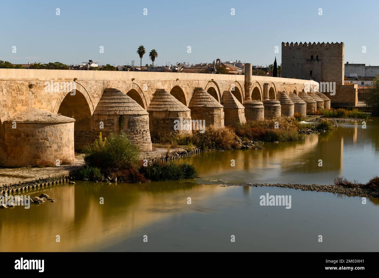 View of the Roman Bridge, a stone bridge that spans the river ...