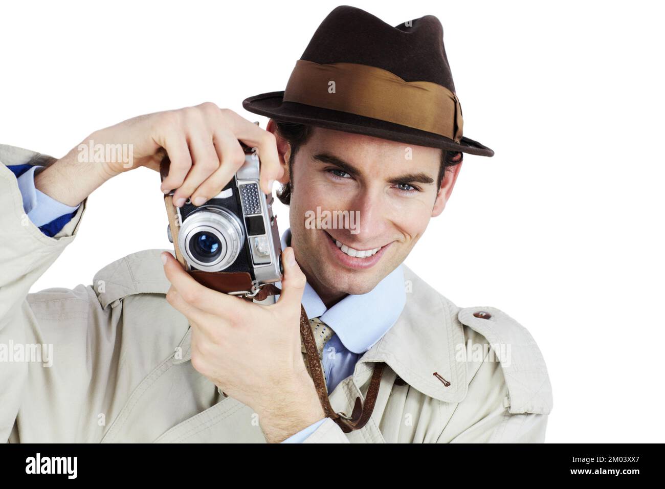 Getting the right shot. Detective taking a photo with a retro camera ...