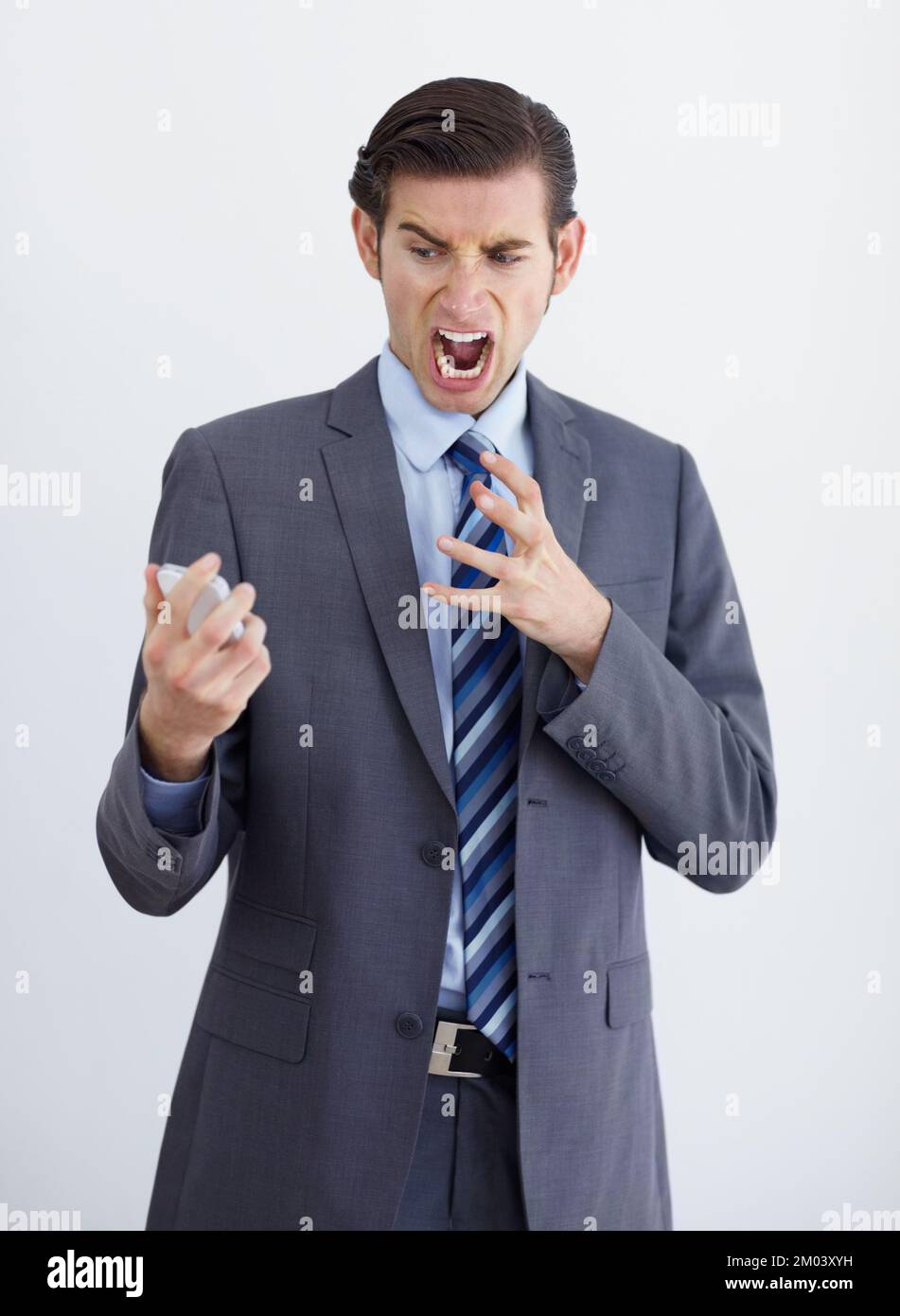 Angry furious businessman working on hi-res stock photography and ...