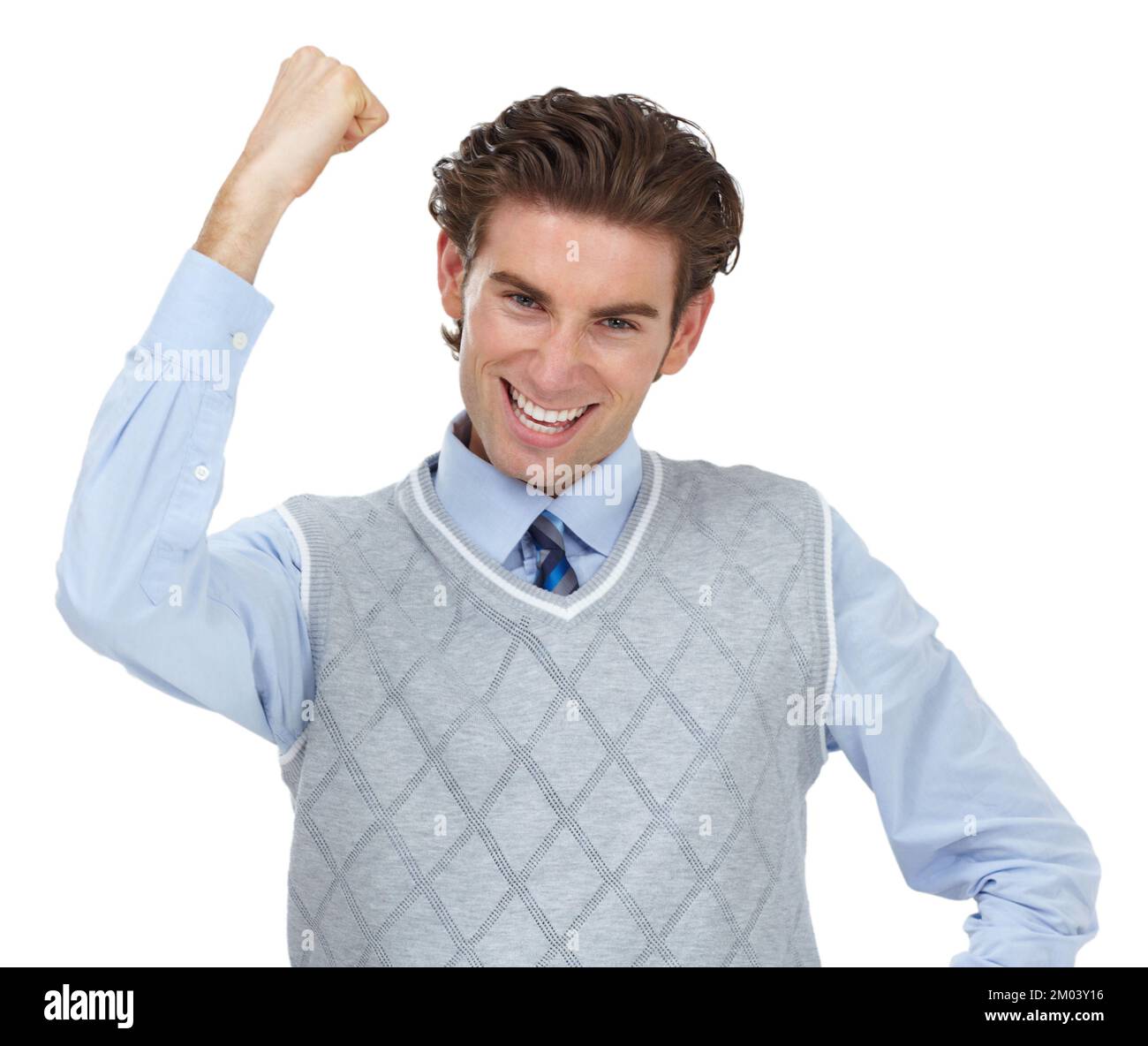 Yet another success. A young man celebrating while isolated on a white ...