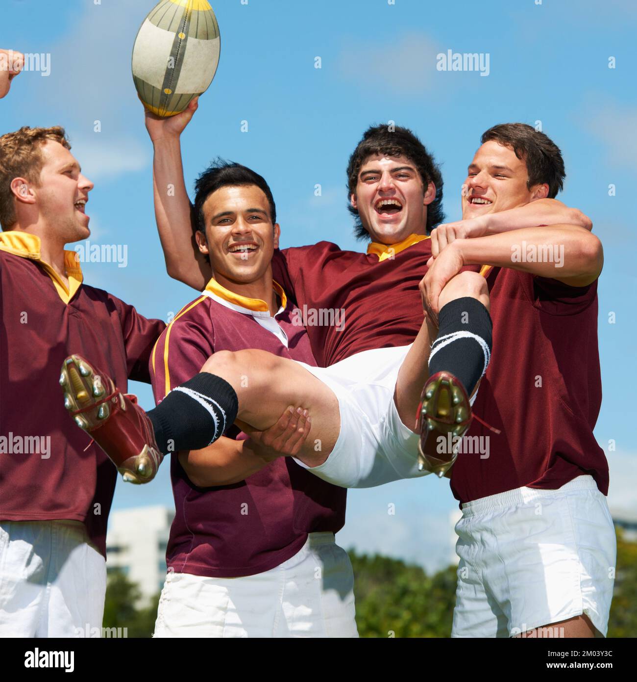 We are going to celebrate tonight. a young rugby team celebrating a ...