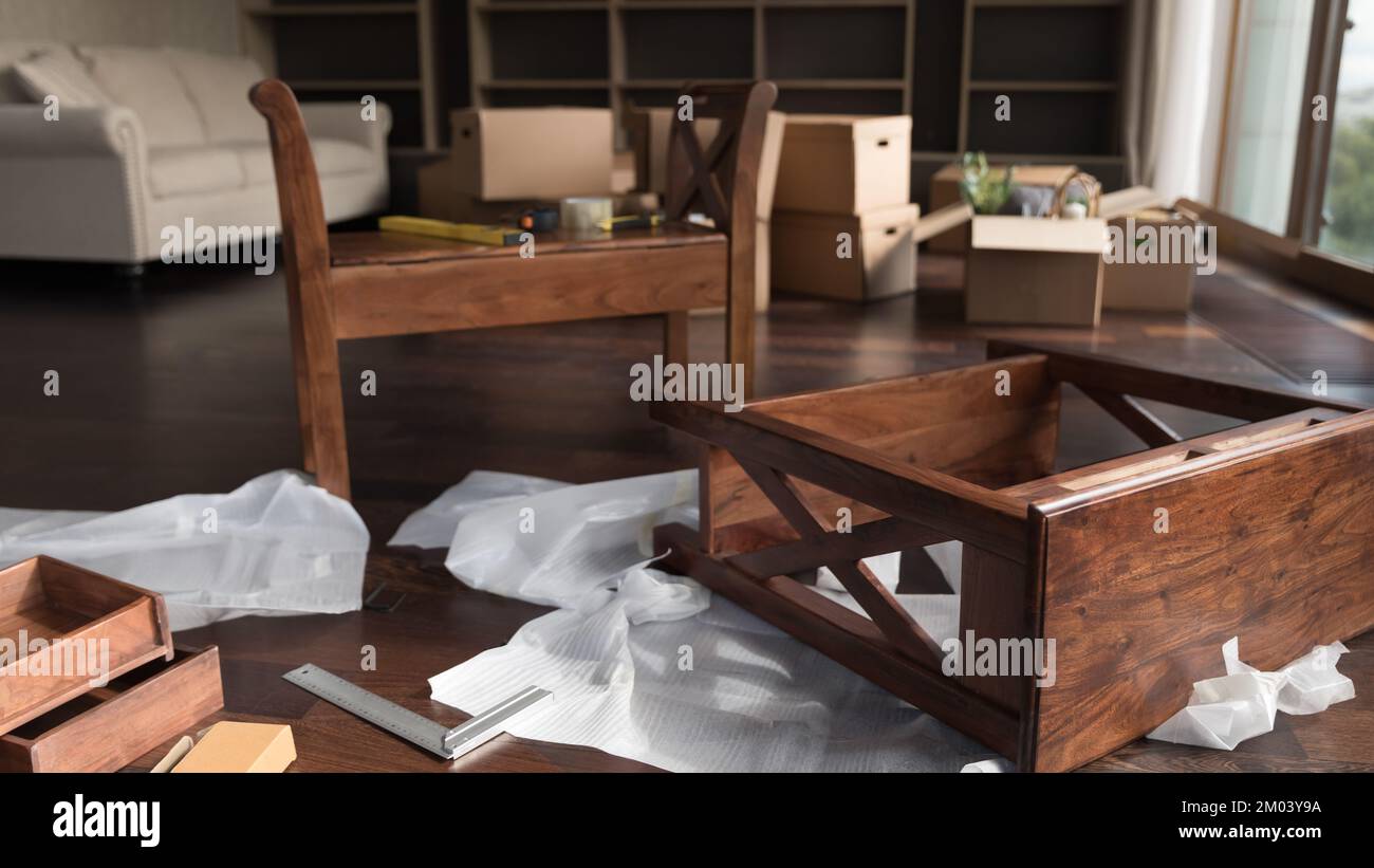 Pieces of wooden furniture, cardboard boxes for moving Stock Photo - Alamy
