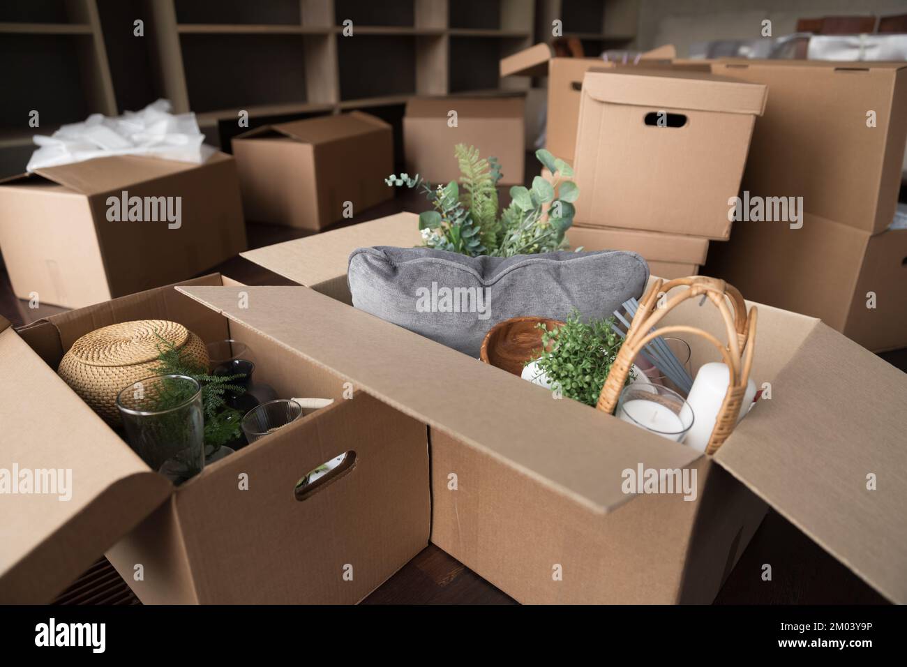 Open cardboard logistic boxes with housing stuff close up Stock Photo ...
