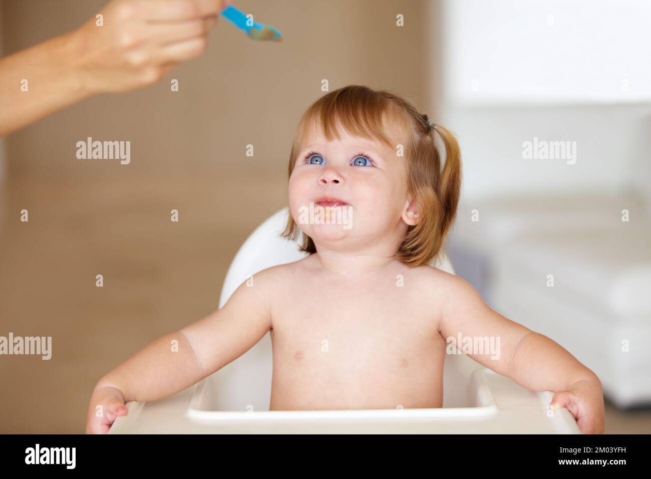 Incoming plane. A mothers hand feeding her baby daughter Stock Photo ...
