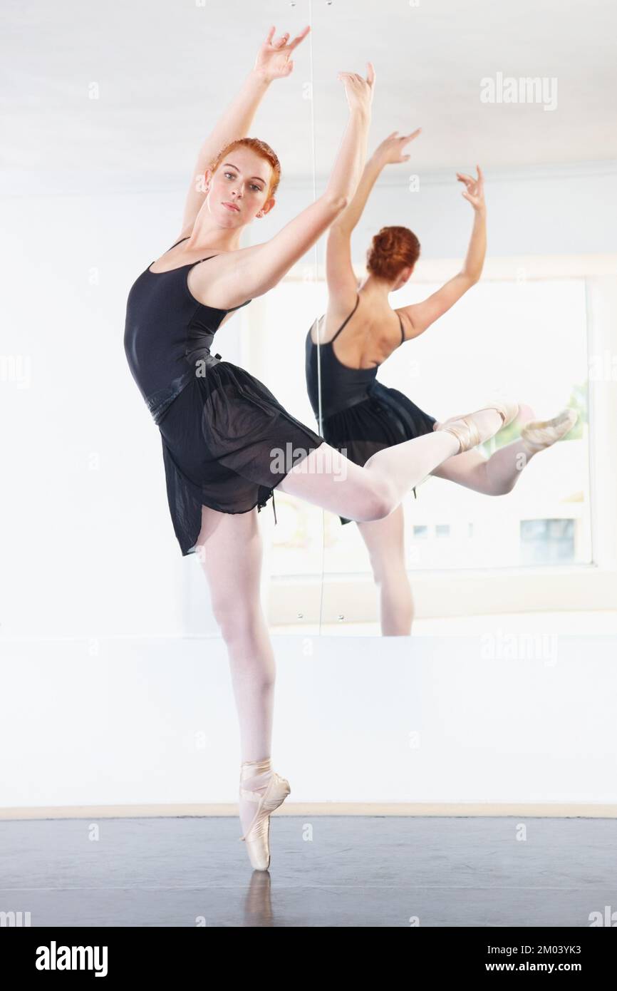 Picture perfect balance. Full length shot of a young ballerina ...
