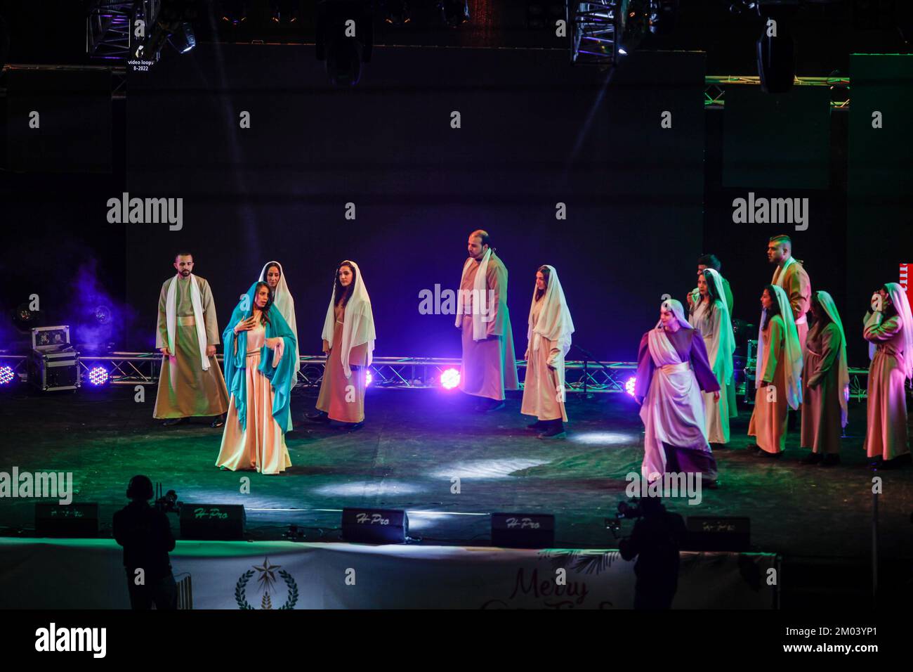 Palestinians perform during a ceremony ahead of the lighting of a ...