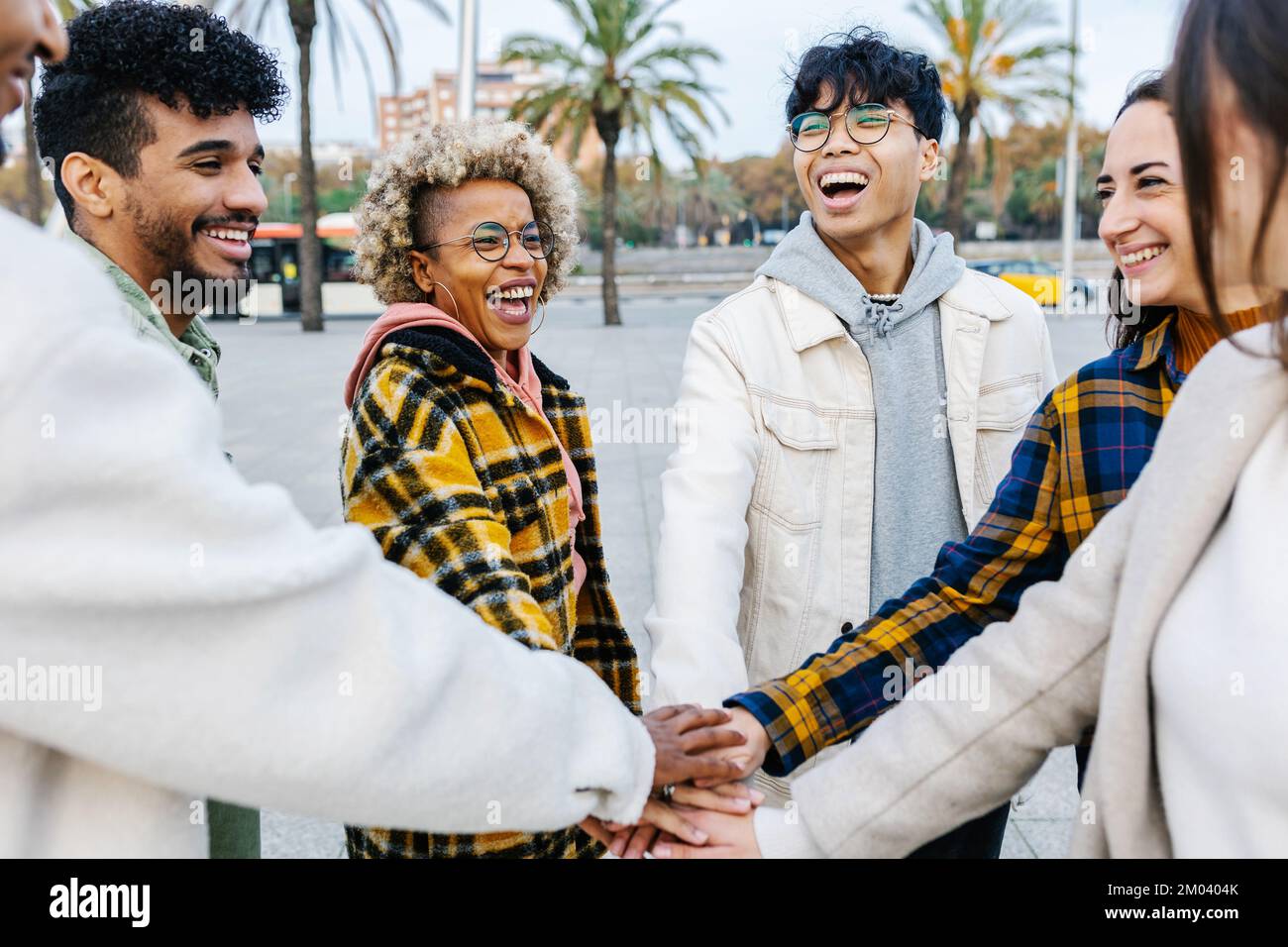 Stack of hands showing unity hi-res stock photography and images - Alamy