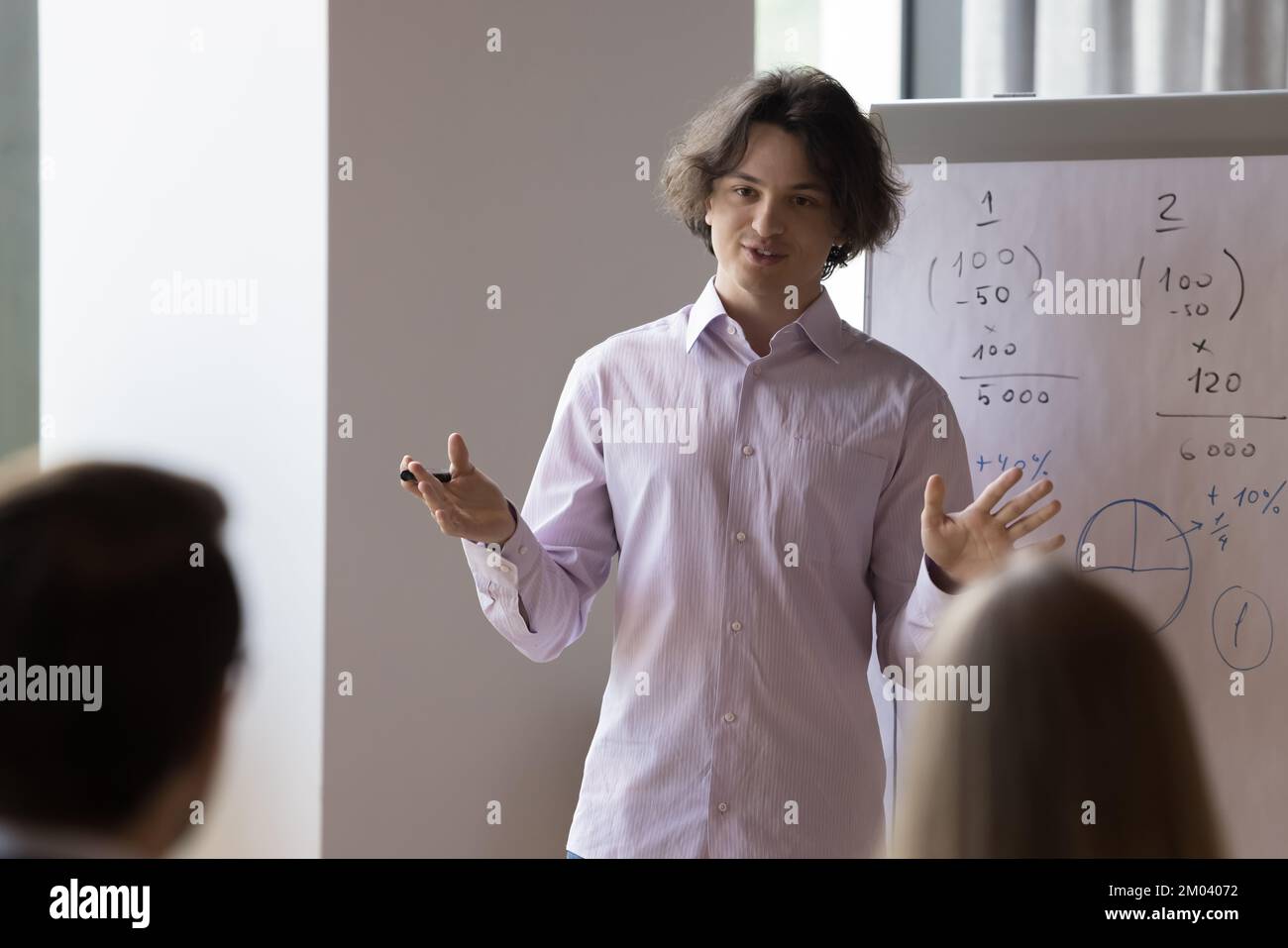 Company ceo gives flipchart presentation with sales data Stock Photo ...