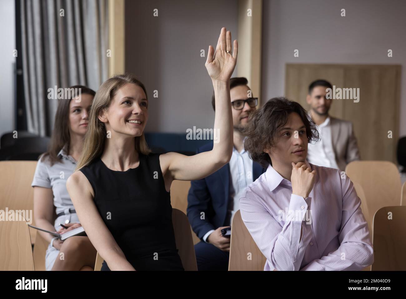 Raising hand group discussion hi-res stock photography and images - Alamy