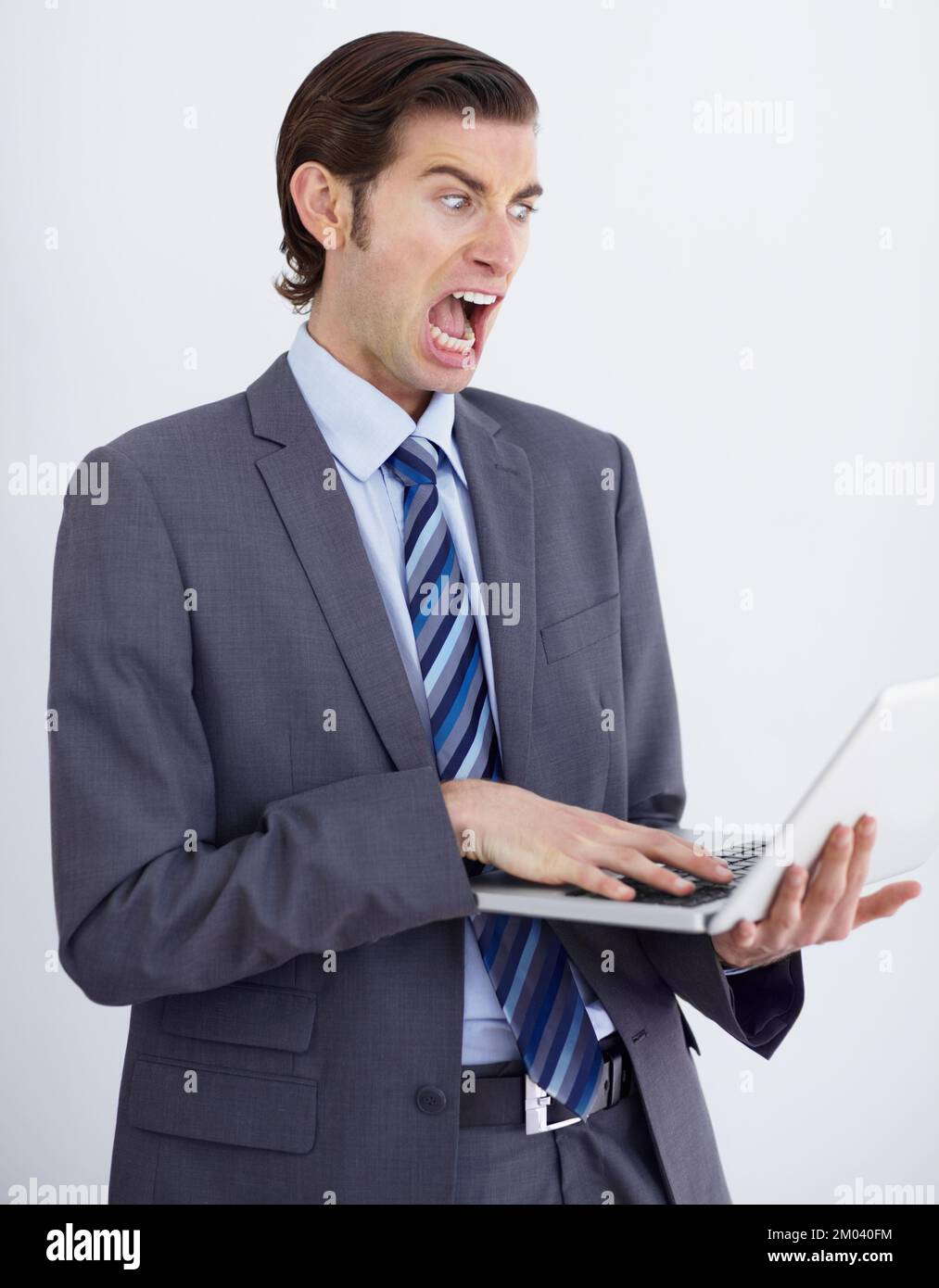 Not again. A crazy businessman screaming at his laptop screen as it ...