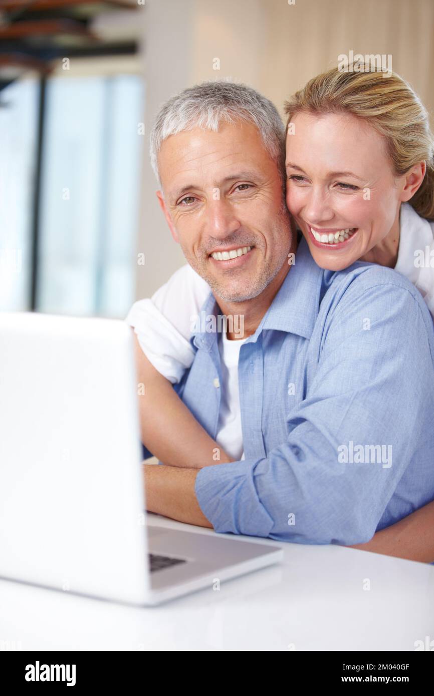 Woman hugging husband works hi-res stock photography and images - Alamy
