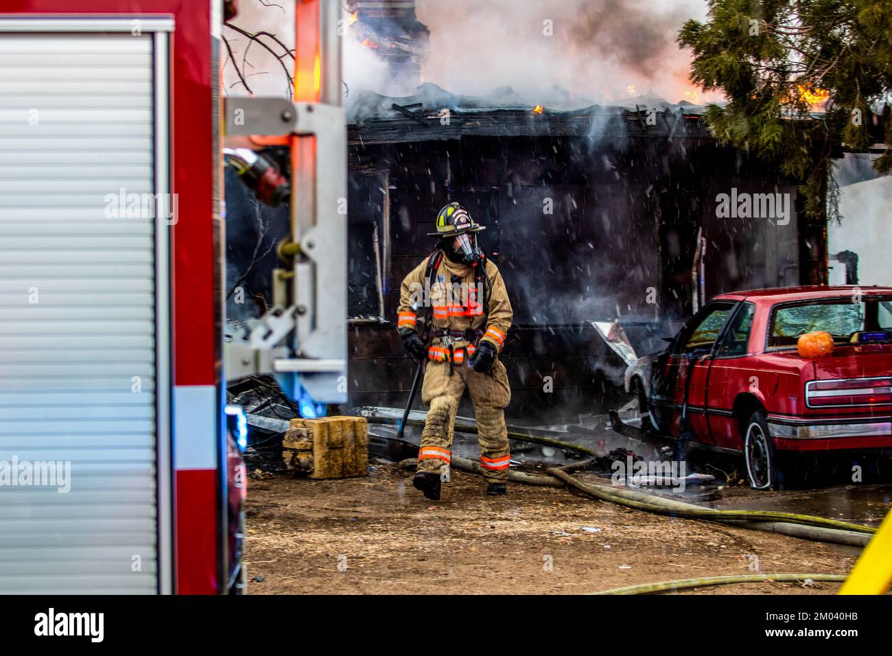 Reno, United States. 03rd Dec, 2022. A firefighter walks out of a ...