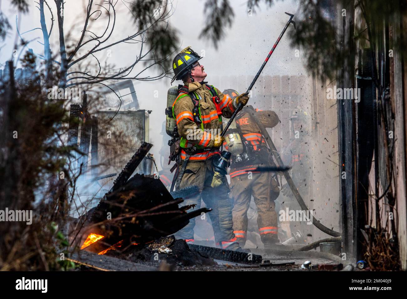 Reno, United States. 03rd Dec, 2022. A firefighter pulls down burning ...