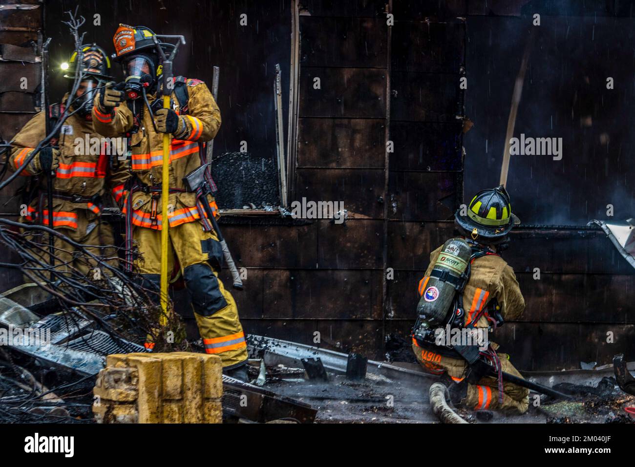 Reno, United States. 03rd Dec, 2022. A firefighter works a hose while ...