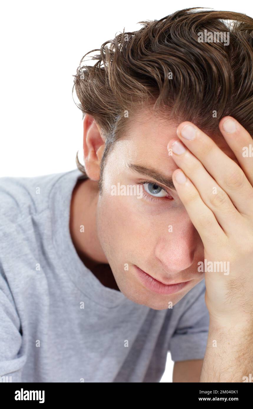 Feeling like a failure. Disheartened young man looking at the camera ...