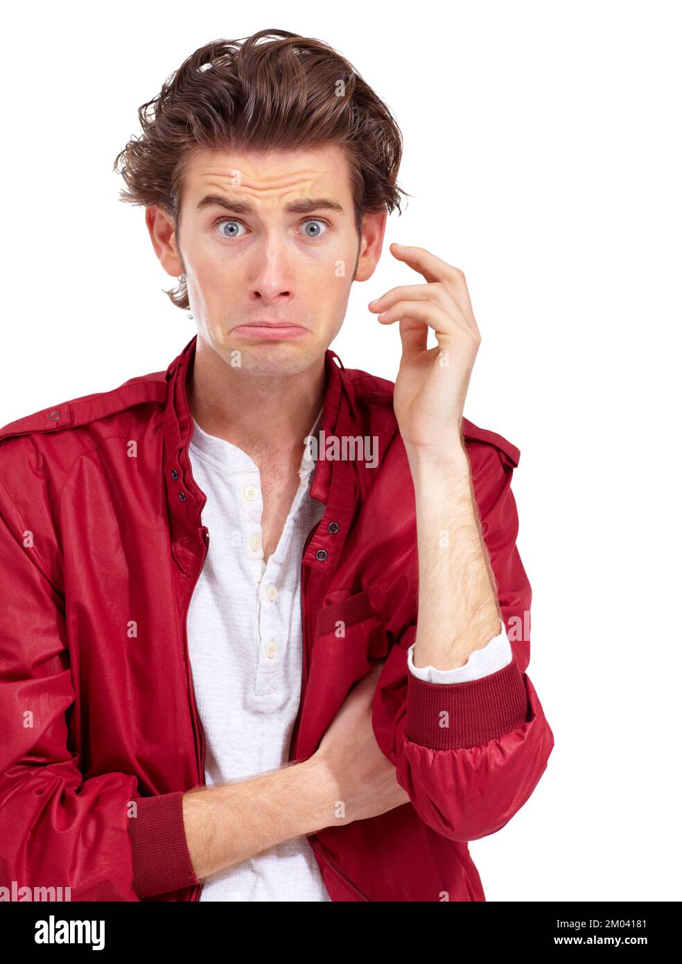 Feeling blue. Young man pouting at the camera while isolated on a white ...