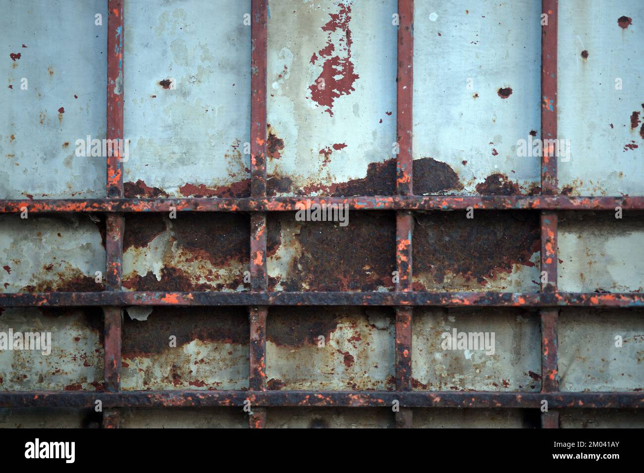Abstract vintage iron door with rusty corrosion marks eroded holes and ...