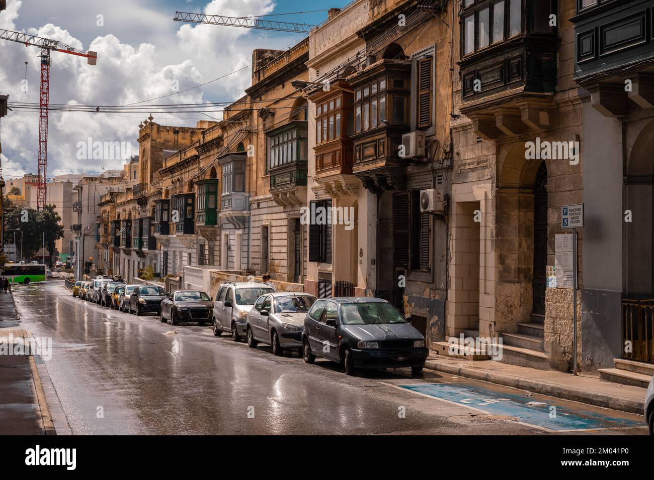 Road in the city of Valletta packed with cars and other traffic ...