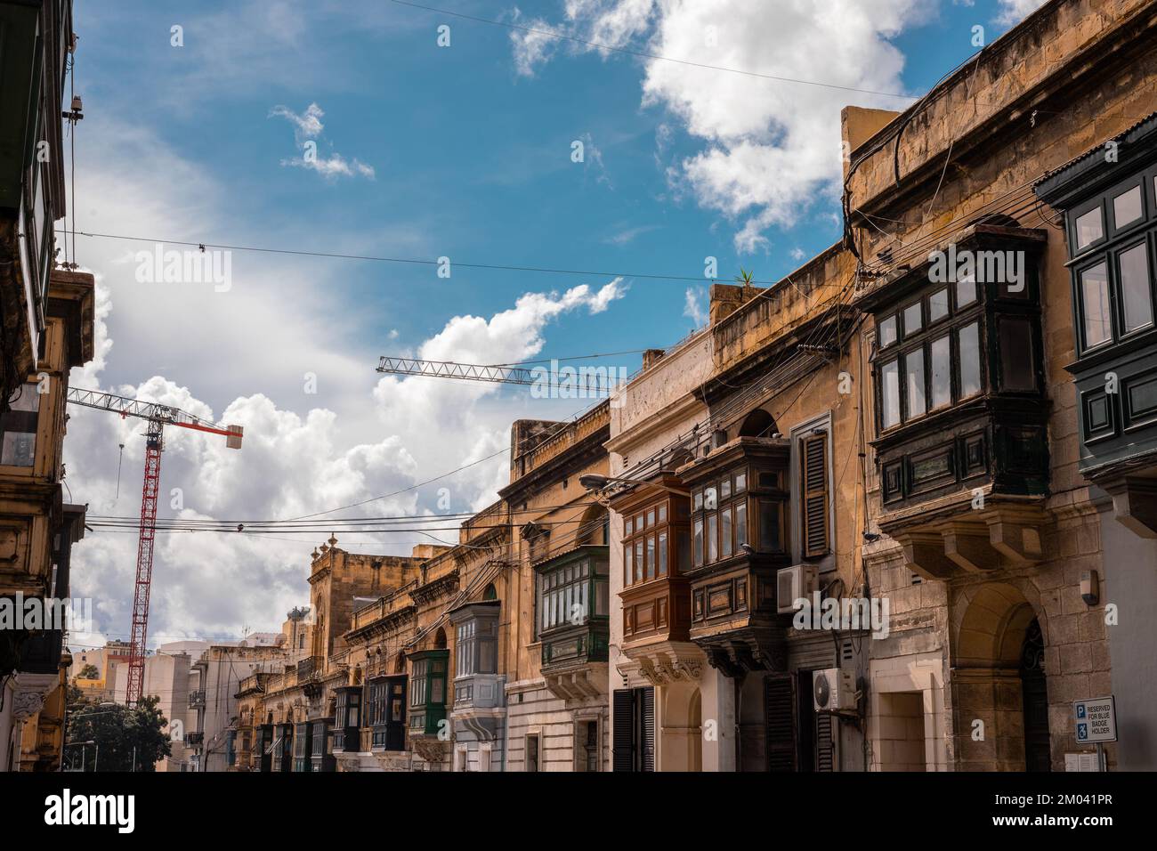 Road in the city of Valletta packed with cars and other traffic ...