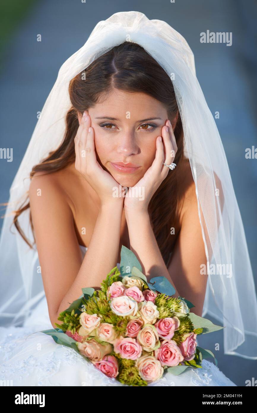 Wedding jitters. a sad-looking young bride on her wedding day Stock ...
