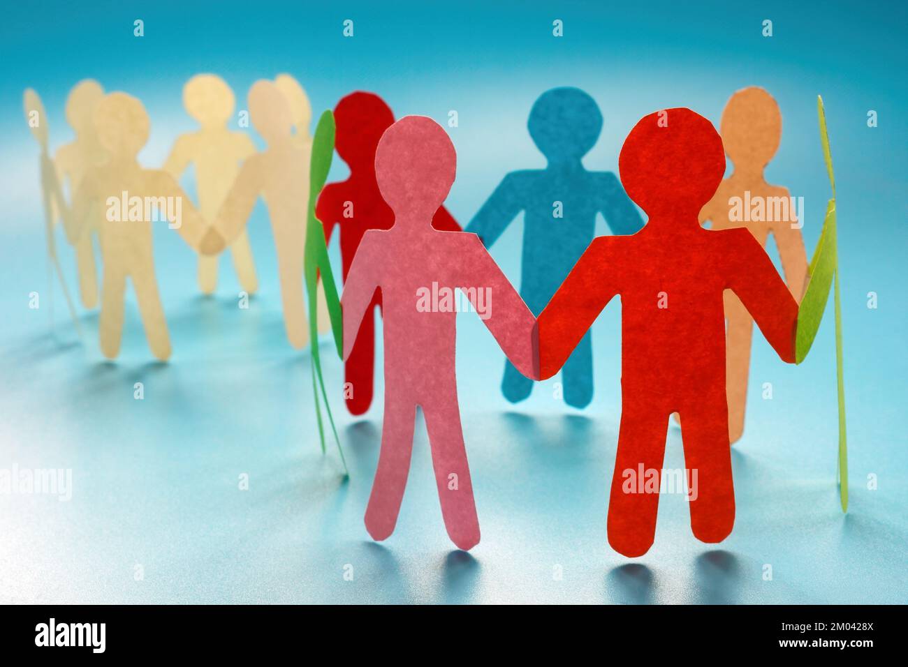 A circle of figurines of different colors and figurines of the same ...
