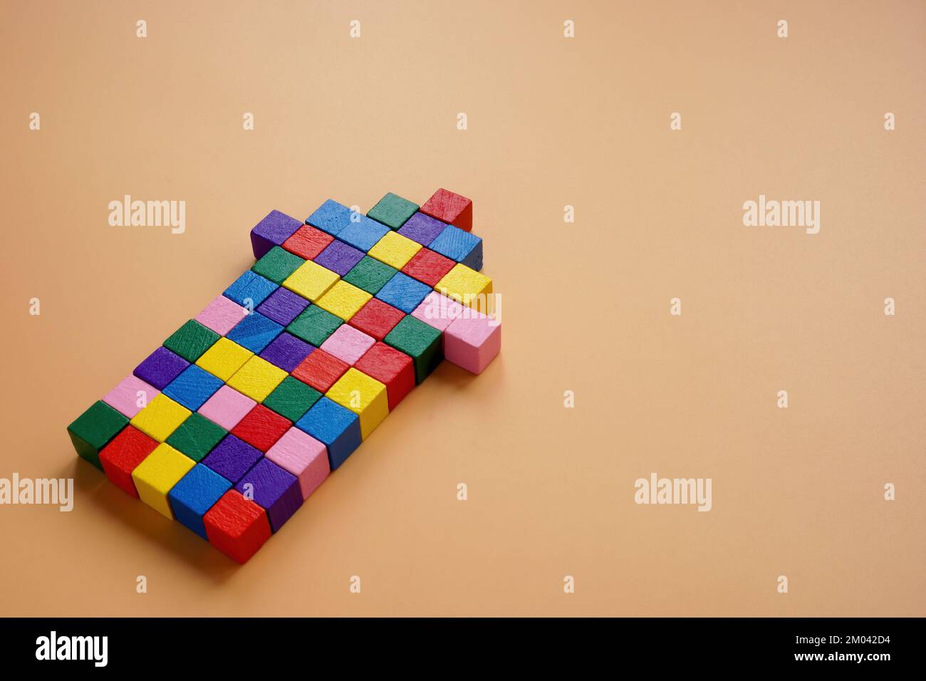 An arrow of multi-colored cubes as a symbol of unity, cooperation and ...