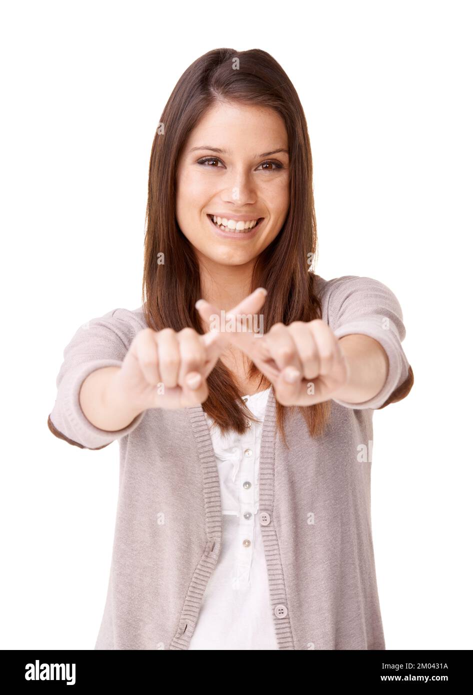 Im saying no. Studio shot of a beautiful young woman making an x with ...