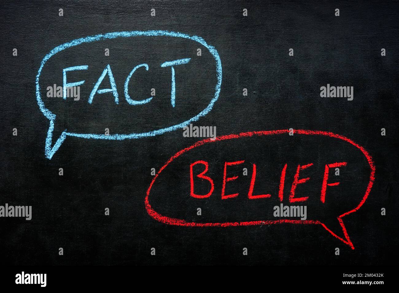 Words fact and belief handwritten on blackboard. Bias concept Stock ...