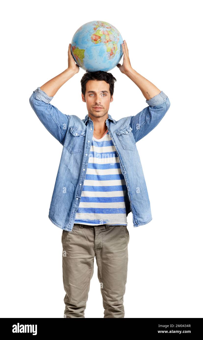Holding the world above his head. A handsome young man holding a globe ...