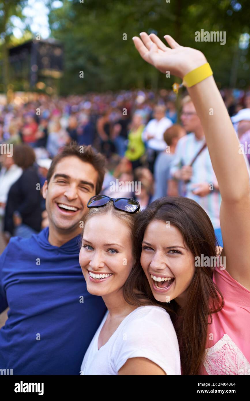 Feeling the festival vibe. A group of friends having fun together at a ...