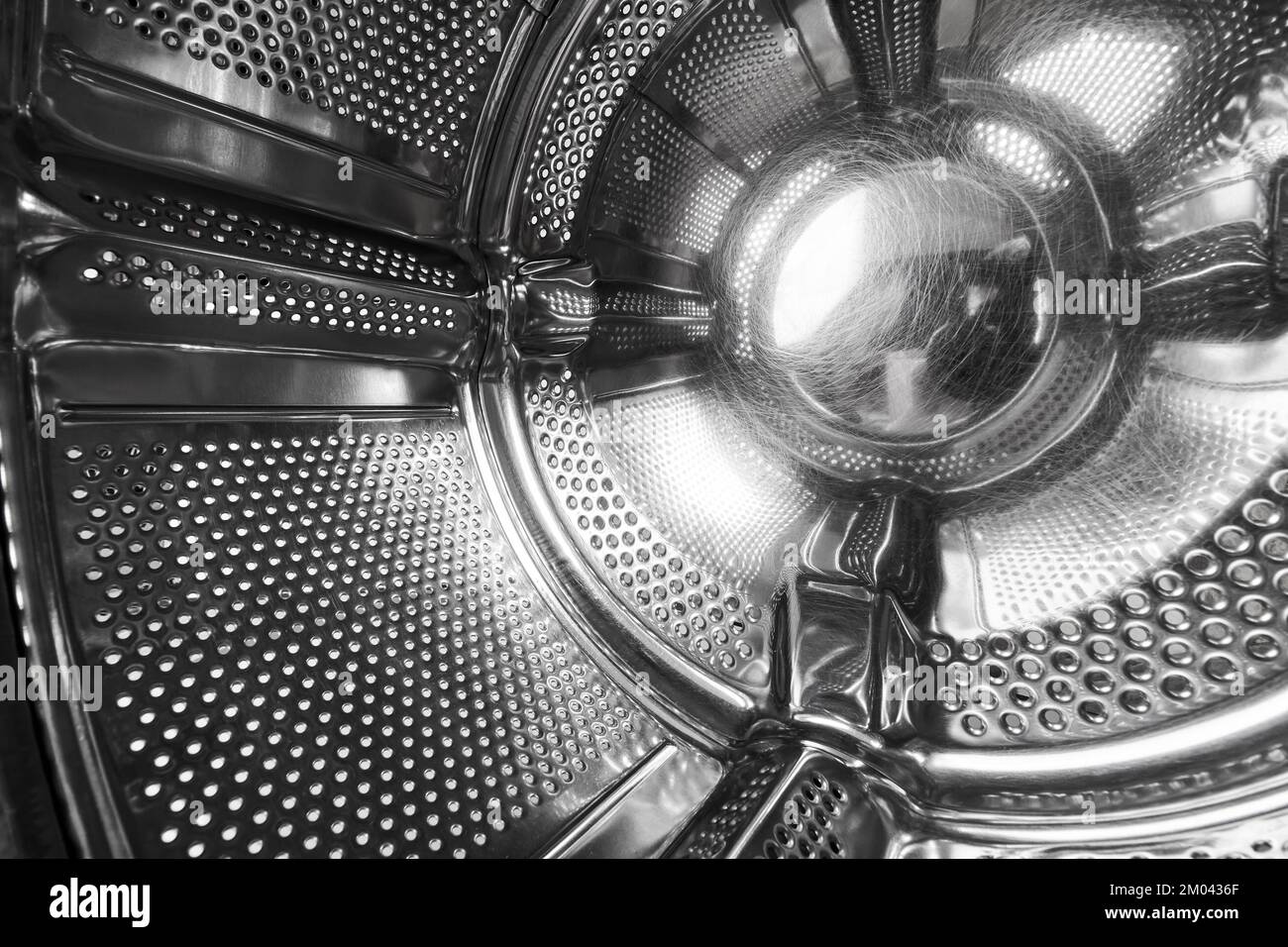 Close-up of inside of a steel washing machine drum Stock Photo - Alamy