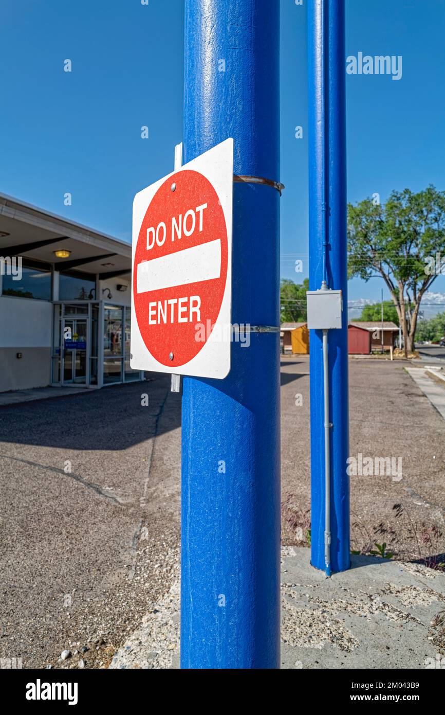 Do Not Enter sign on a blue pole Stock Photo - Alamy