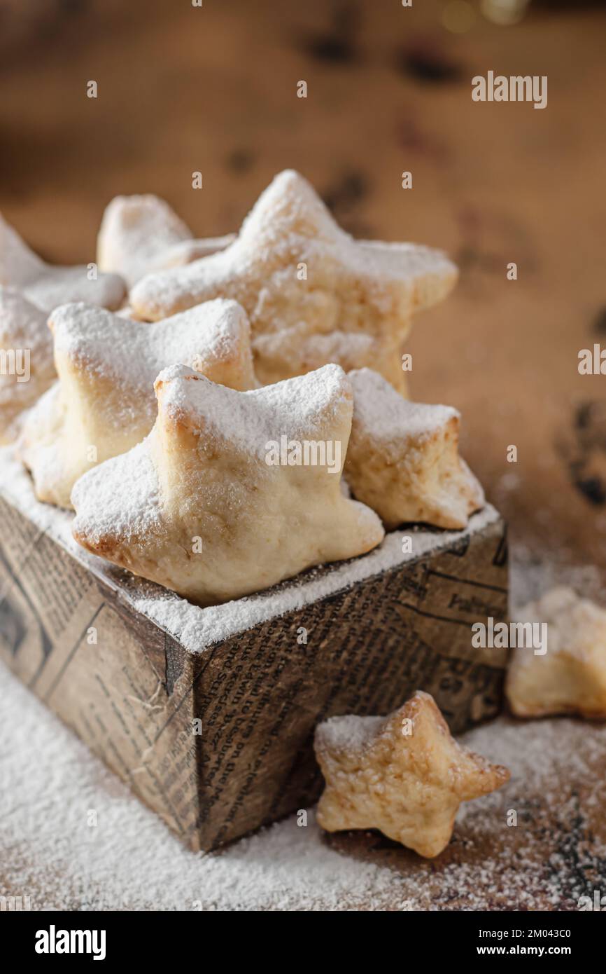 Homemade Christmas shortbread star shape cookies with powdered sugar in ...