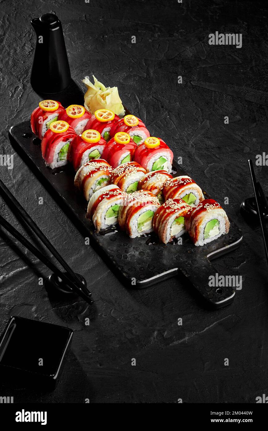 Set of Philadelphia rolls with eel and tuna served with pickled ginger ...