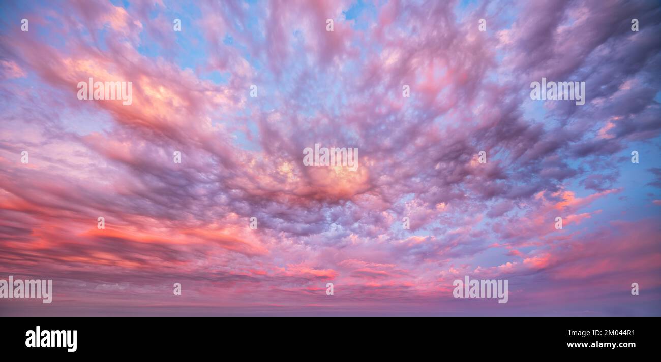 Atmospheric sky with luminous clouds at sunrise Stock Photo - Alamy
