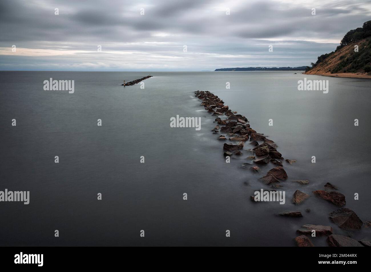 Coastal protection made of boulders, coastline on the Baltic Sea, dusk ...