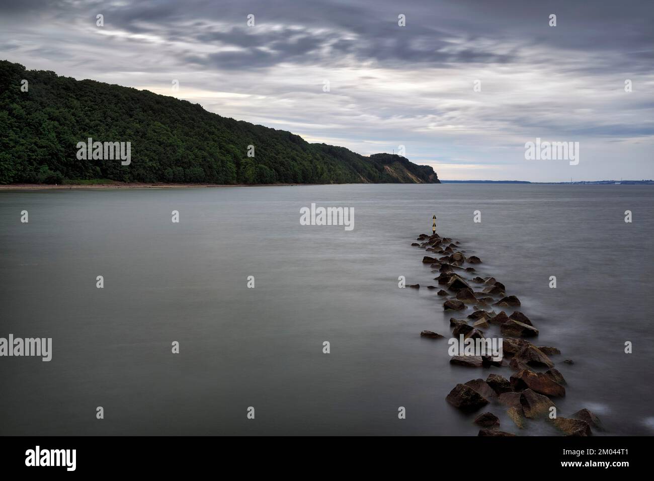 Coastal protection made of boulders, coastline on the Baltic Sea, dusk ...