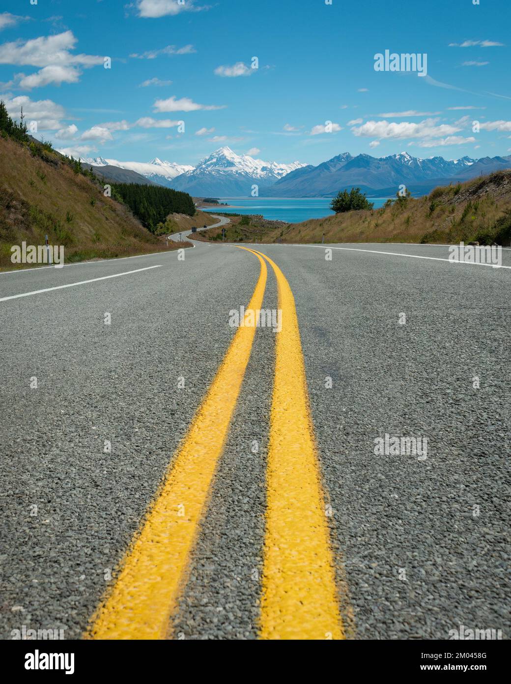 Mt Cook road with double yellow lines in the middle, snow-capped Mt ...