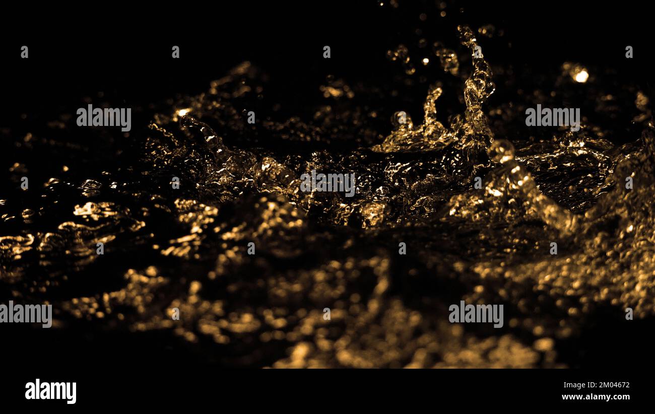 Hi speed close up images of oil liquid from diesel gasoline splashing ...