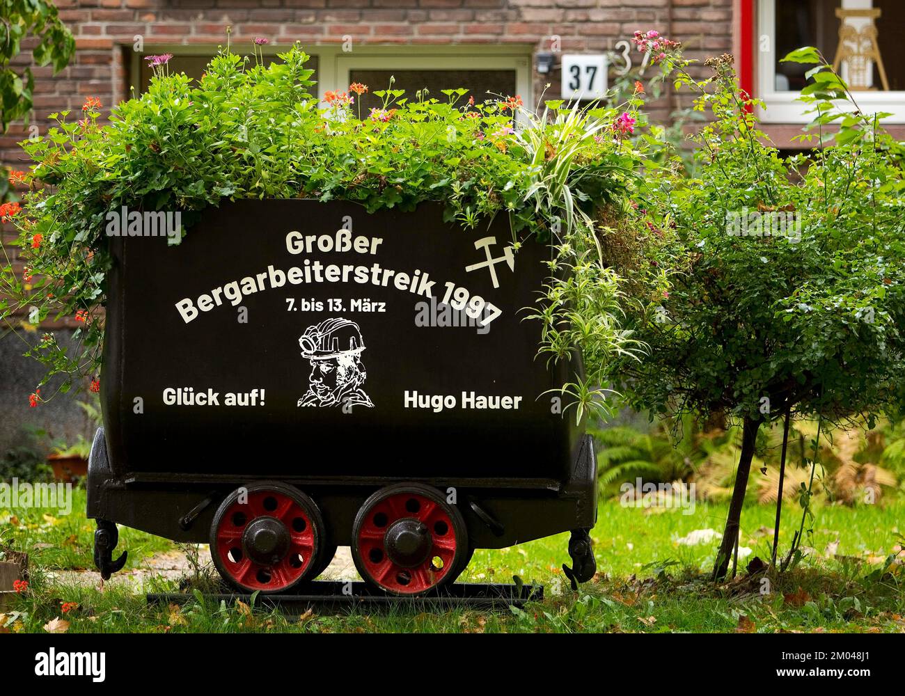 Coal lorry in the front garden commemorating the big miners' strike in ...