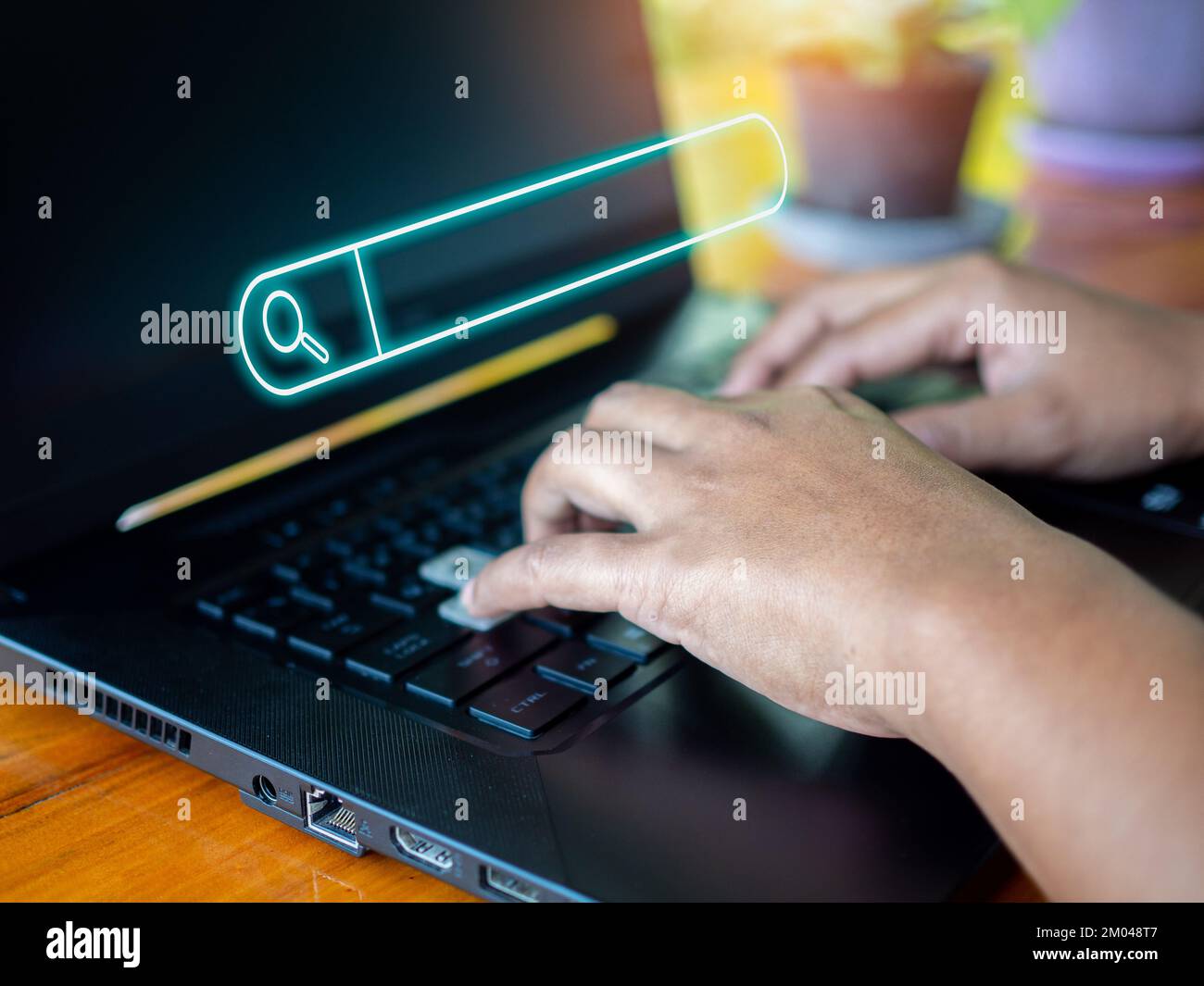 Human hand working on computer and search icon. The concept of ...