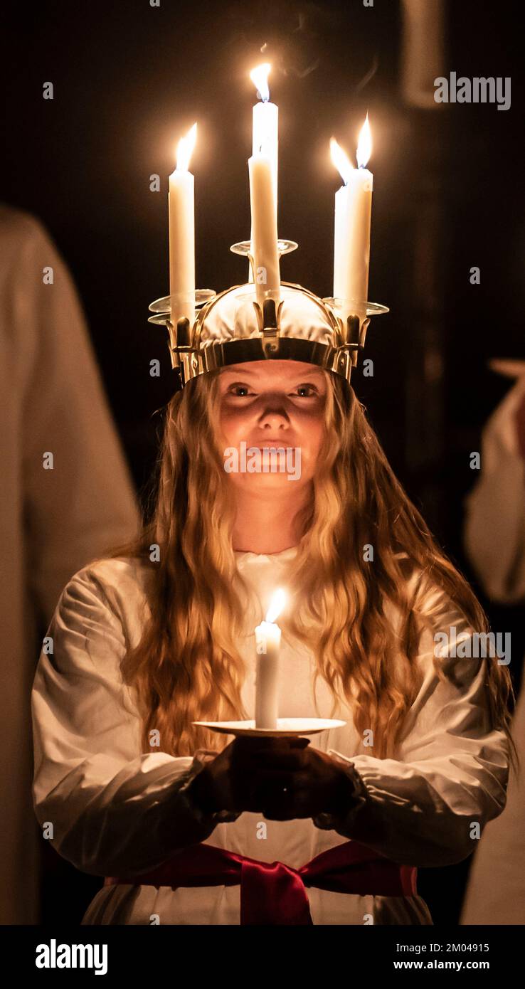 Clara Nordin wears a crown of candles symbolising St Lucy as she leads ...