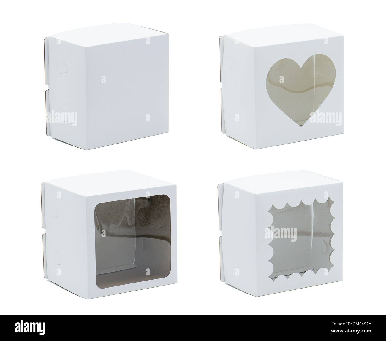 White cardboard boxes with clear plastic windows of different shape ...
